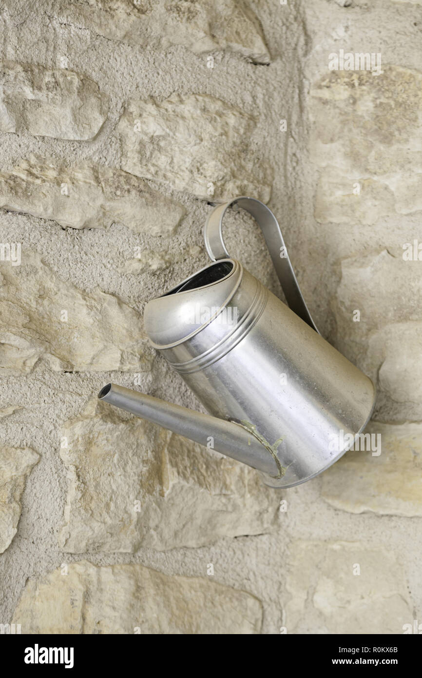 Old metal container, detail of an old metal pitcher, liquid transport ...