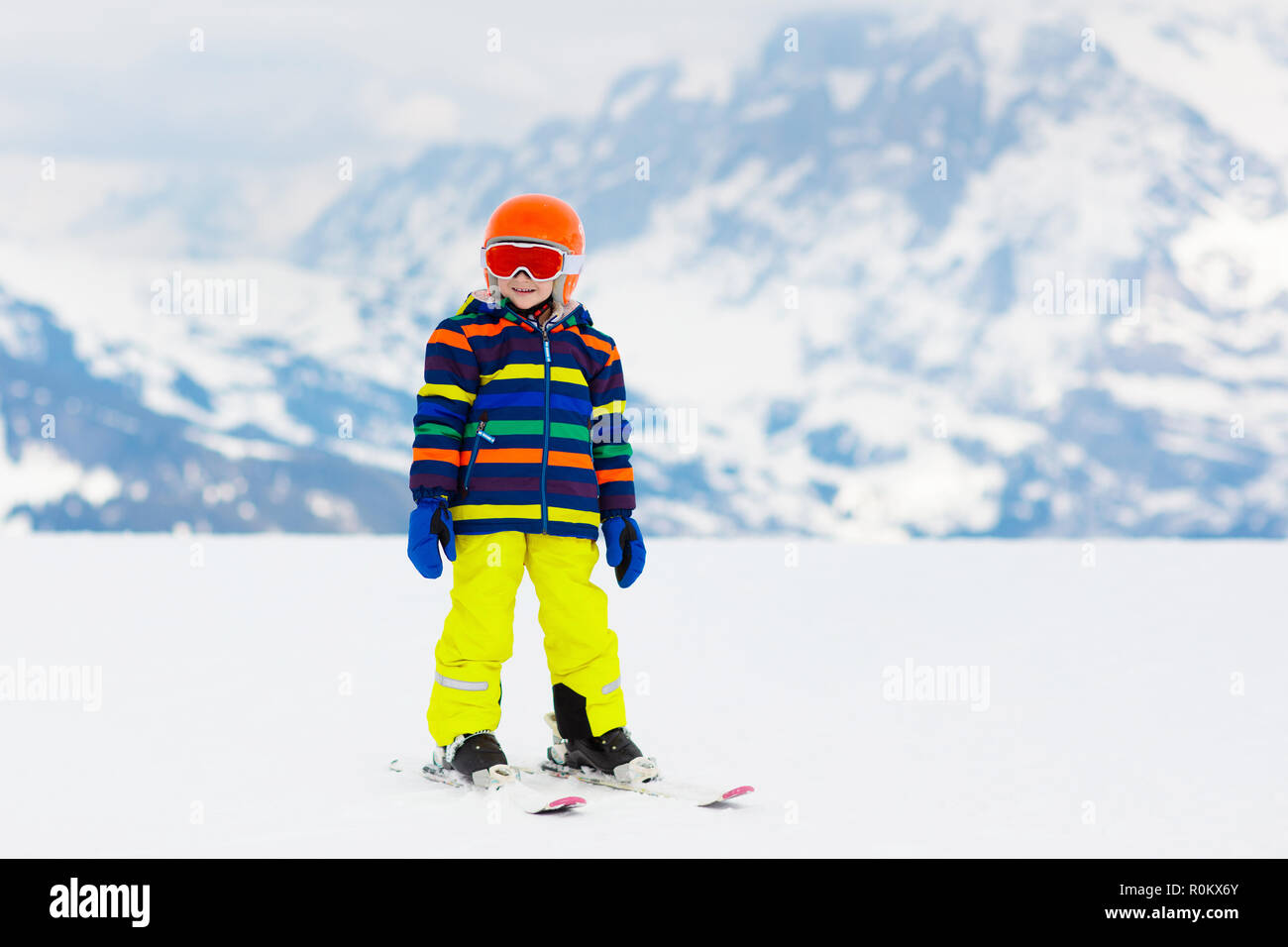 Child skiing in the mountains. Kid in ski school. Winter sport for kids ...