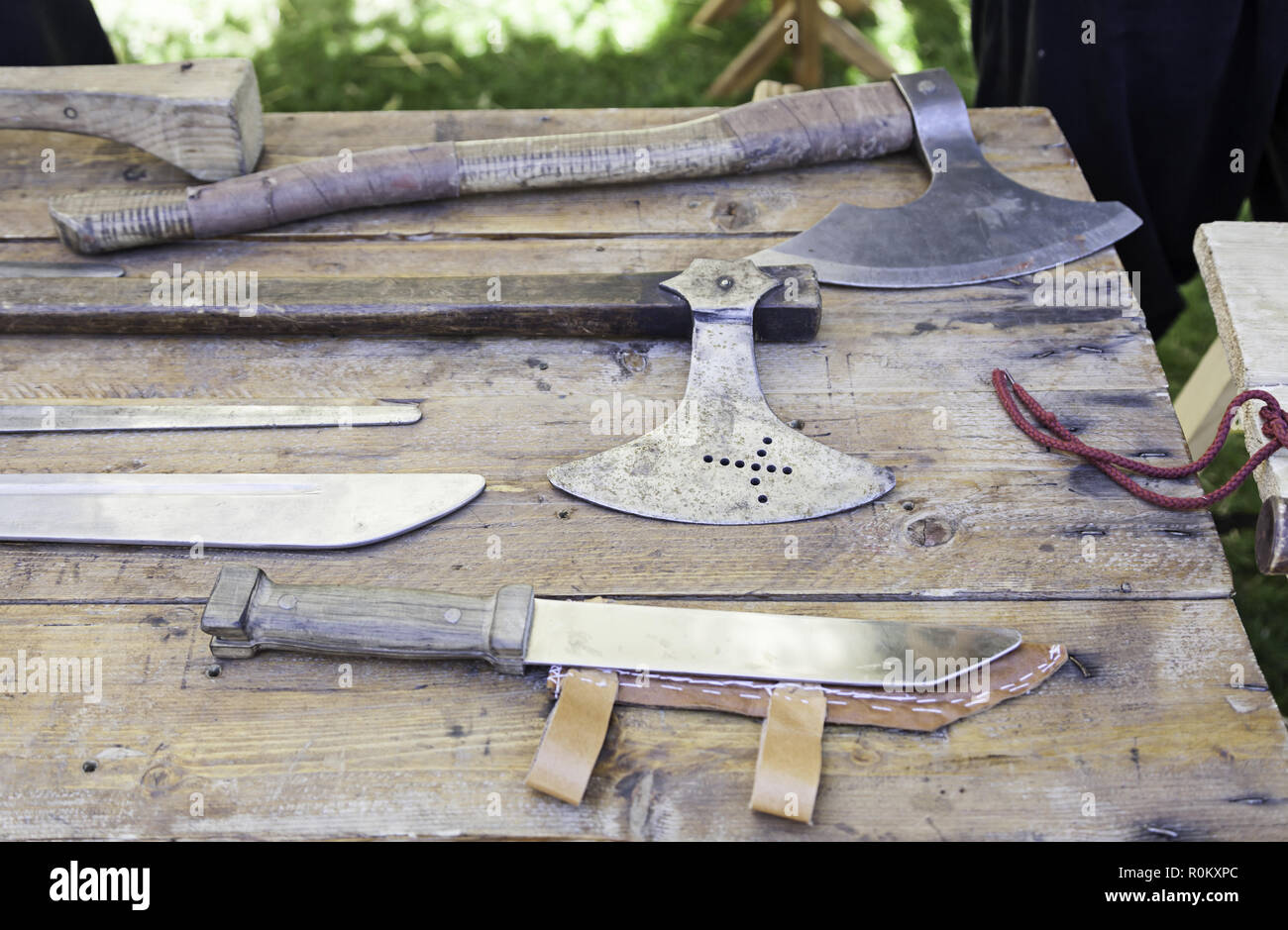 Axes and knives medieval, detail of some ancient weapons of war, pain ...