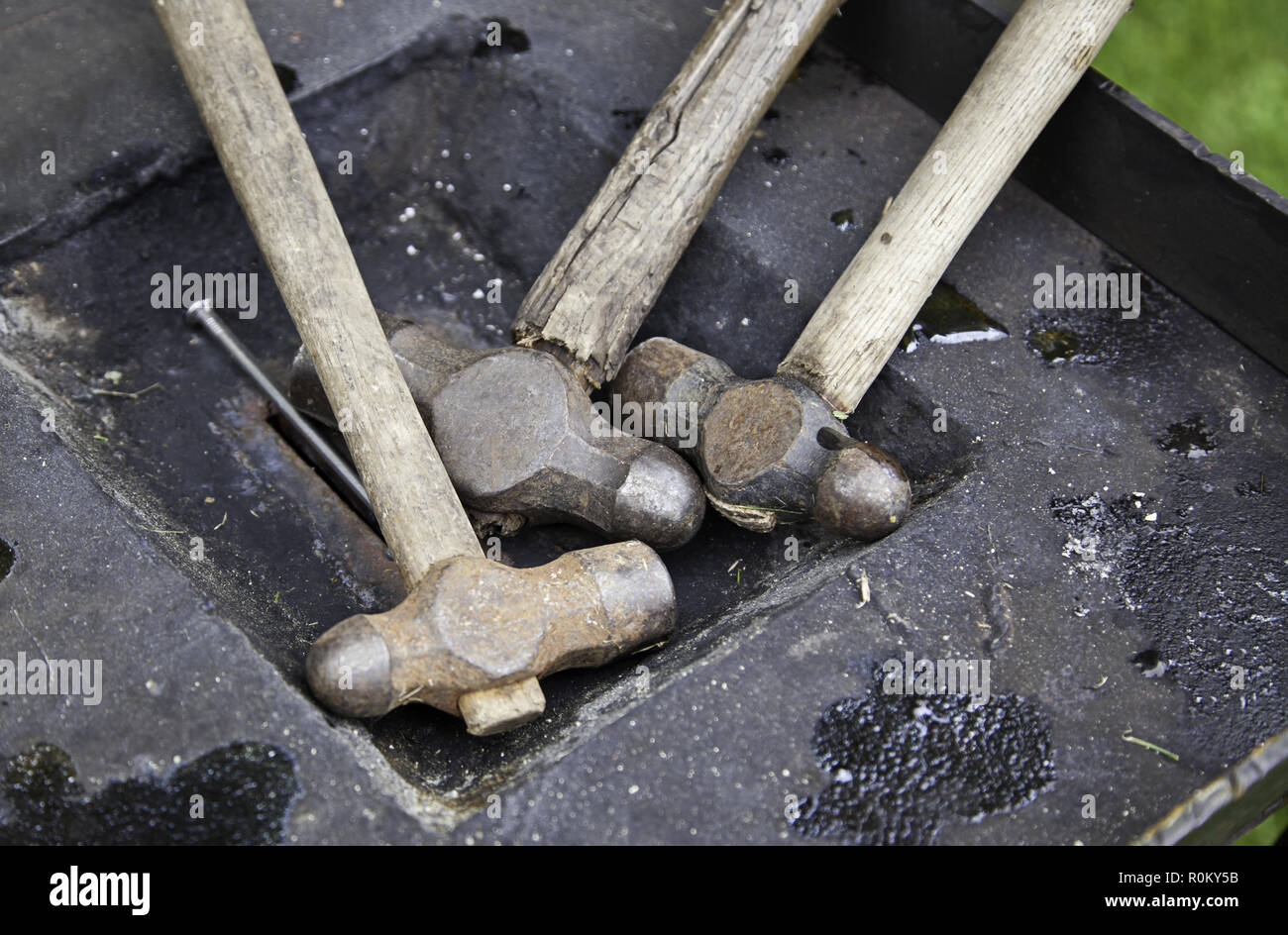 Steel Hammers, detail of a metal forging hammers, anvil, medieval tool ...