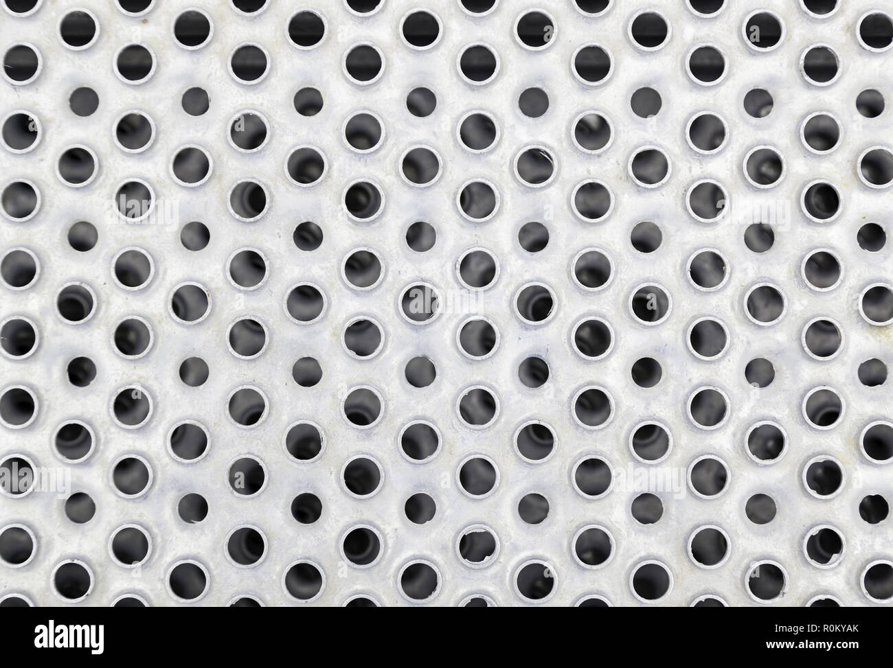 Metal plate with holes, detail of a steel plate with ciruclos, strength ...