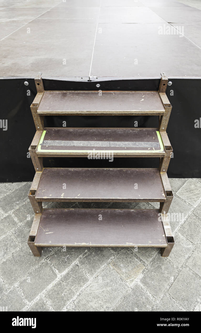 Metal stairs on the street, detail of a staircase on a stage of a ...