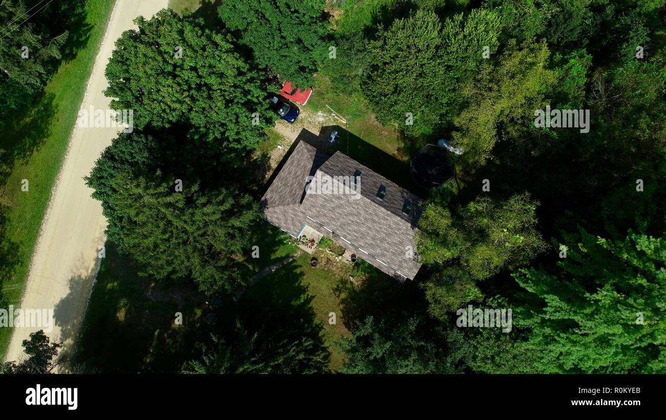 Aerial view of woods forests along Zumbro River, with old white house ...