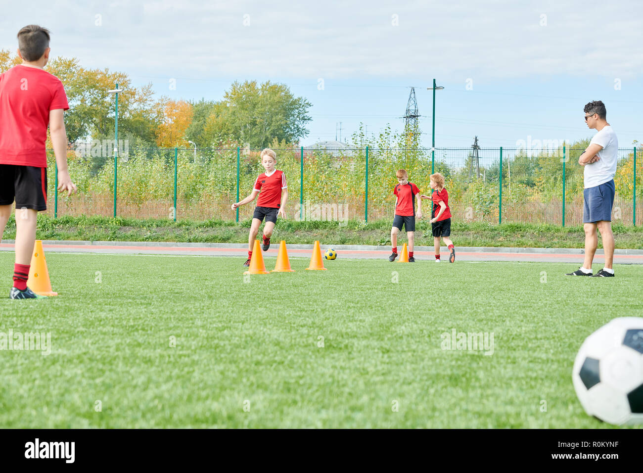 Football Practice Outdoors Stock Photo - Alamy