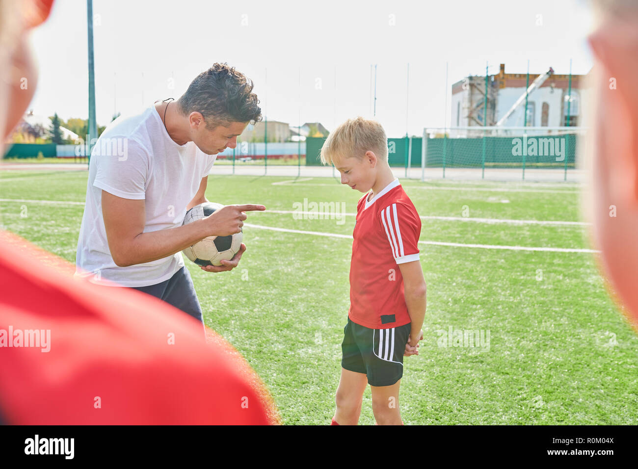 Coach Motivating Boy Stock Photo - Alamy