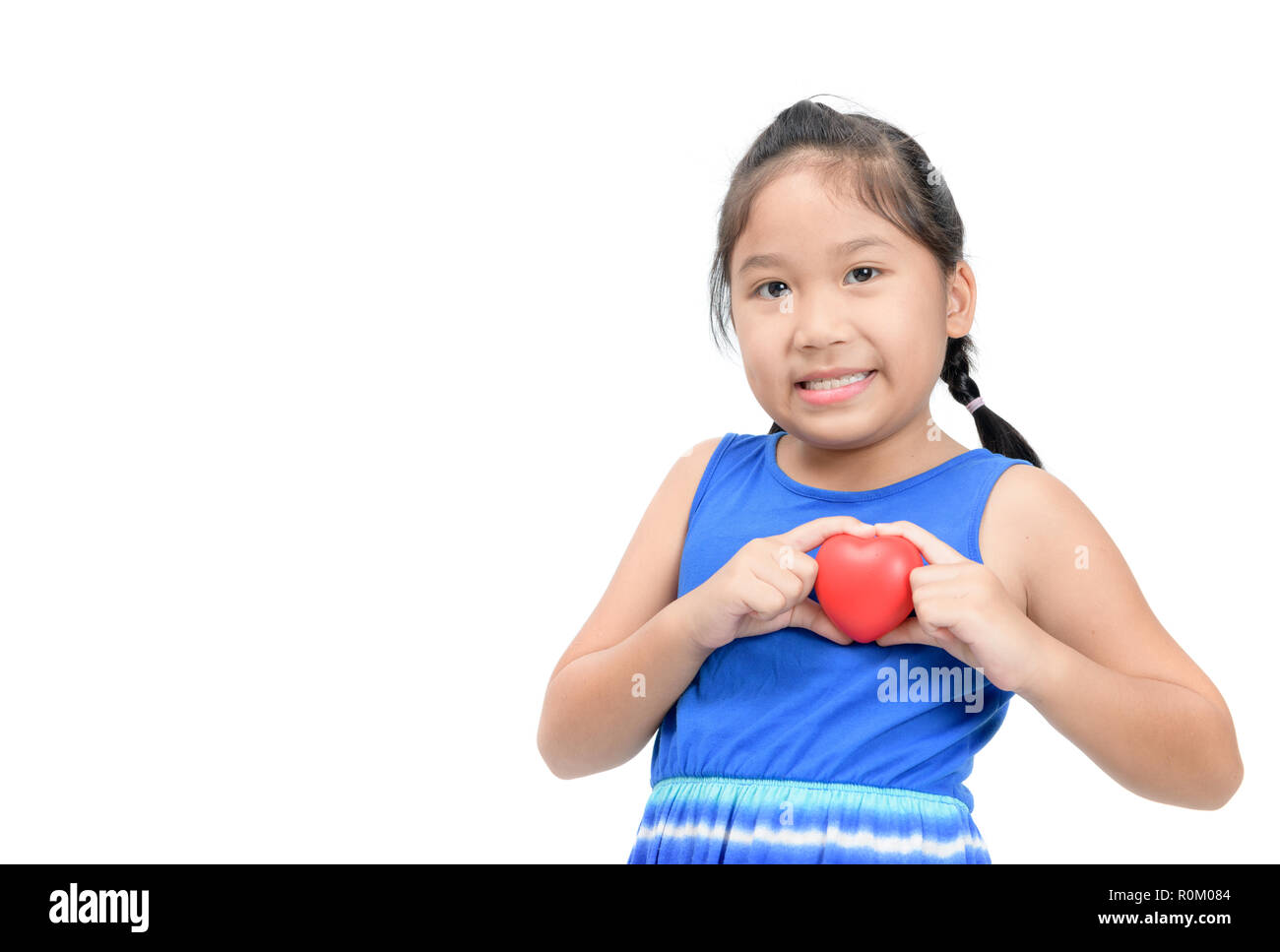 Cute asian girl show little red heart in hand isolated on white ...