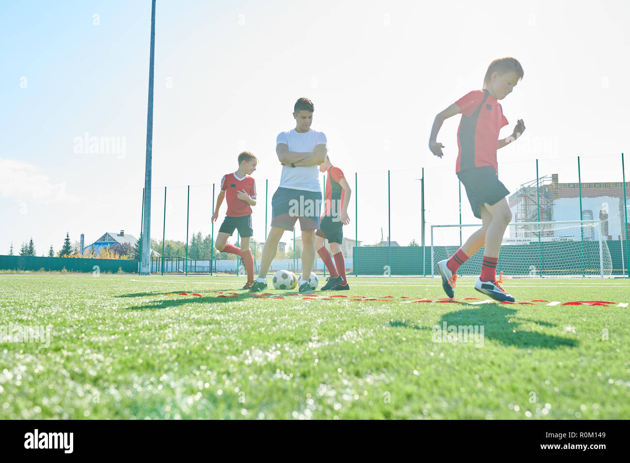 Football Coach Working with team Stock Photo - Alamy