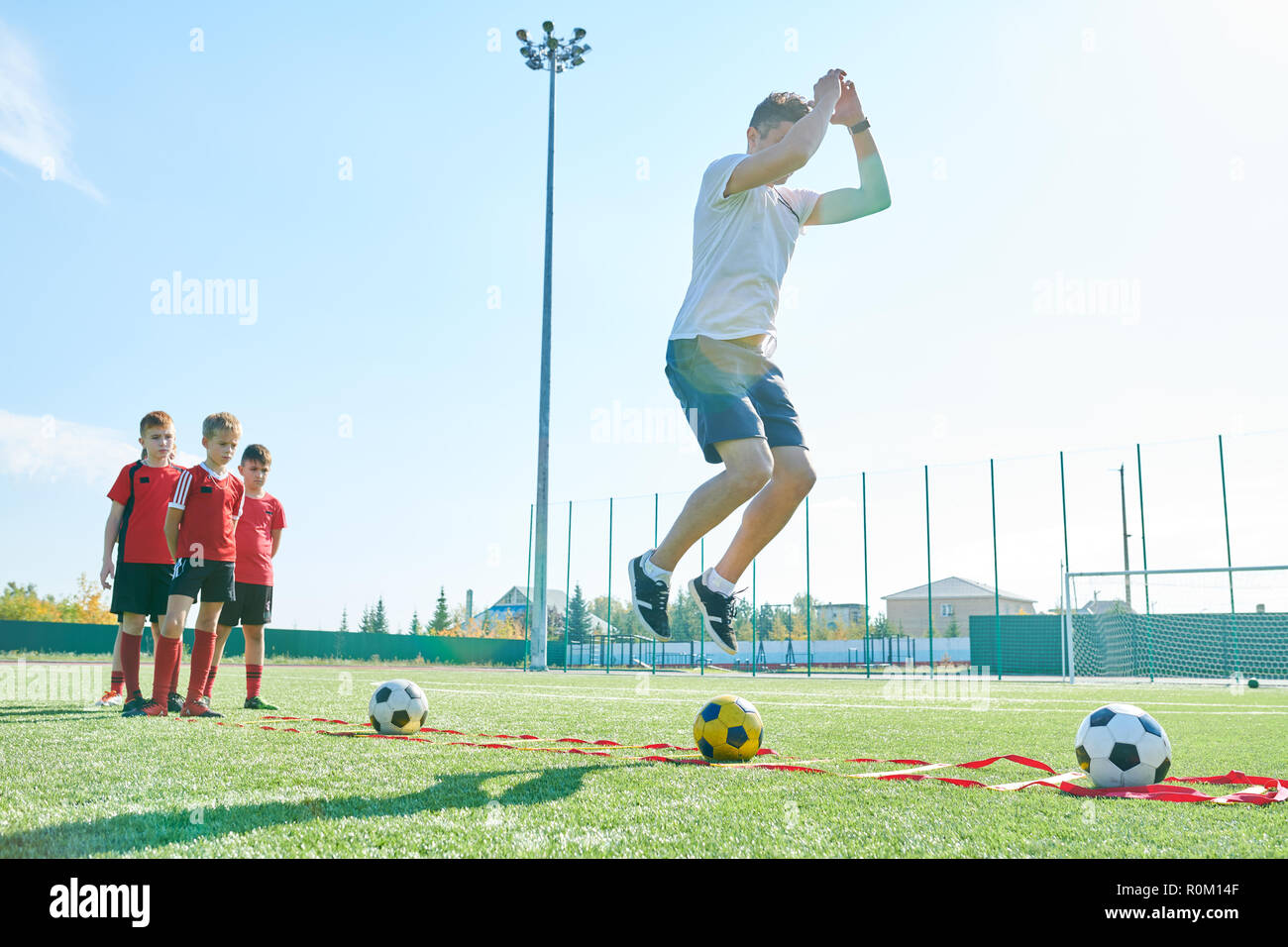 Coach Training with Football Team Stock Photo - Alamy