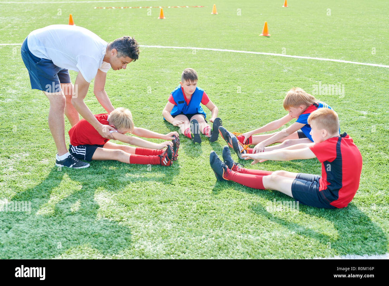 Soccer boy stretching hi-res stock photography and images - Alamy
