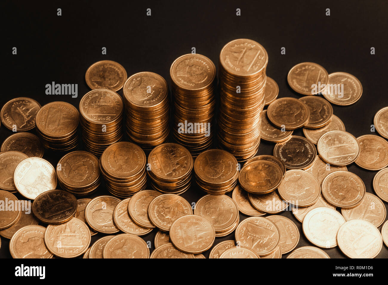 Savings, increasing columns of coins, piles of coins arranged as a ...