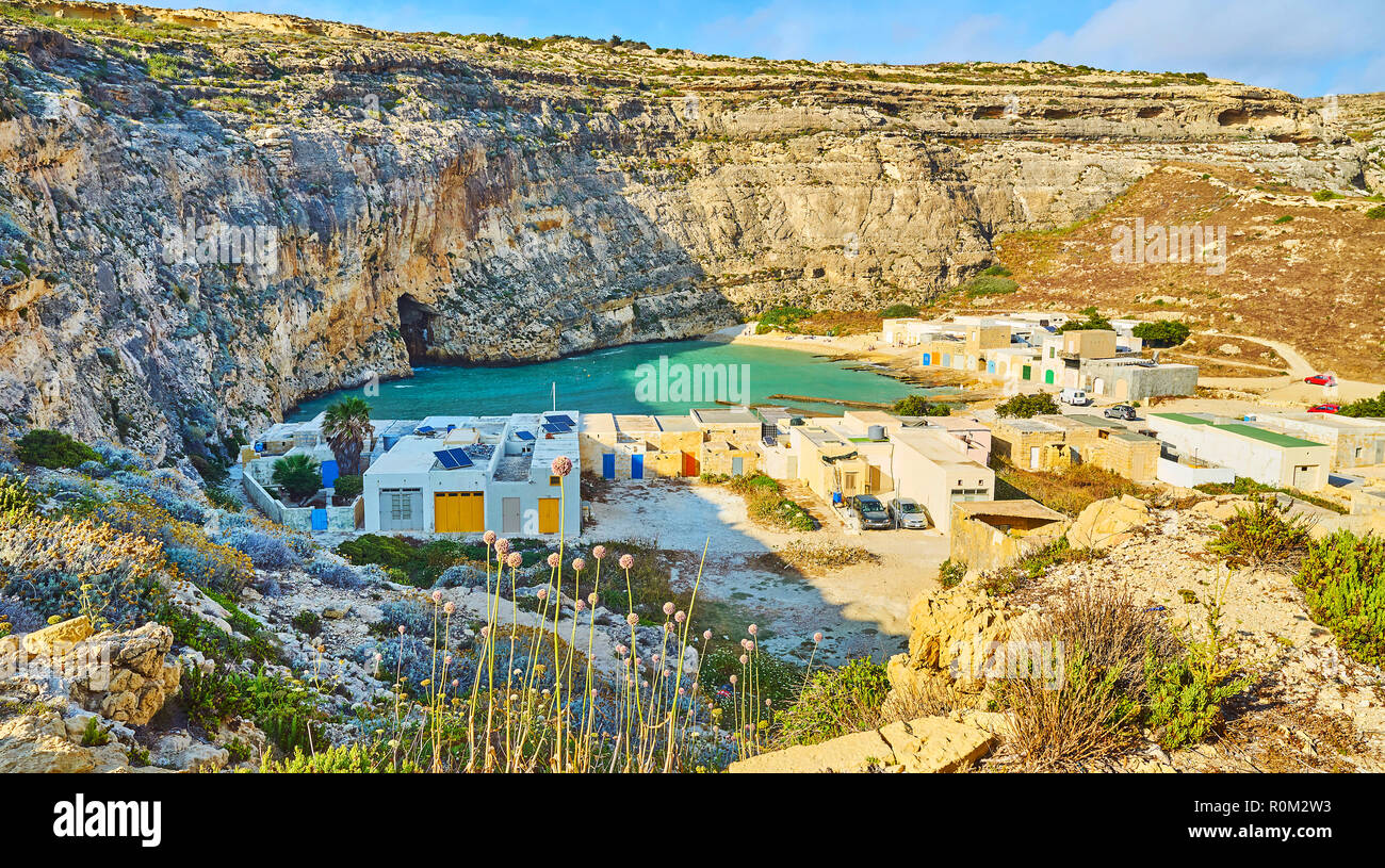 The picturesque site of Dwejra Inland sea, surrounded with massive ...
