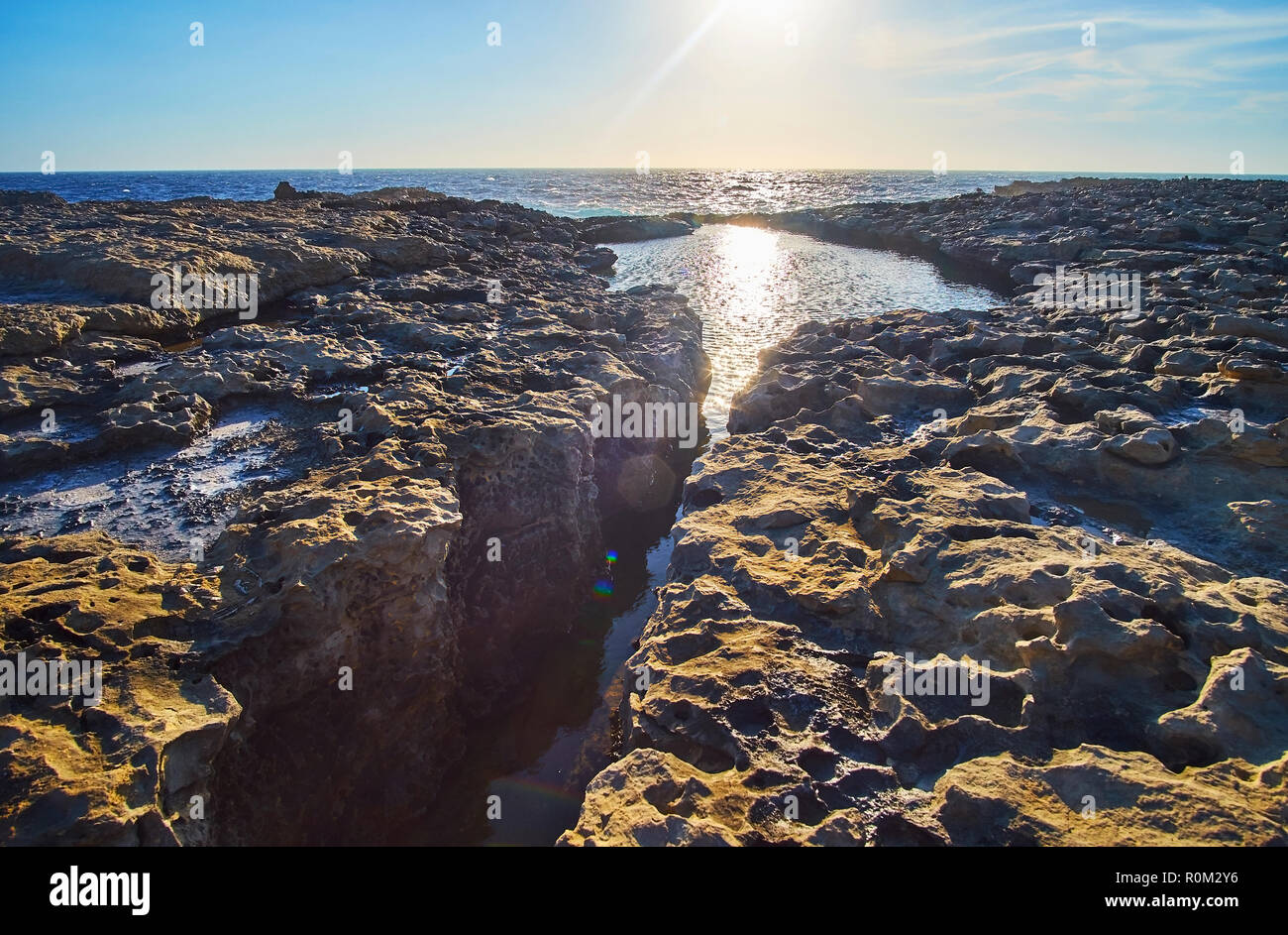Indented rocky coast of San Lawrenz is rich in tiny calm and quiet ...