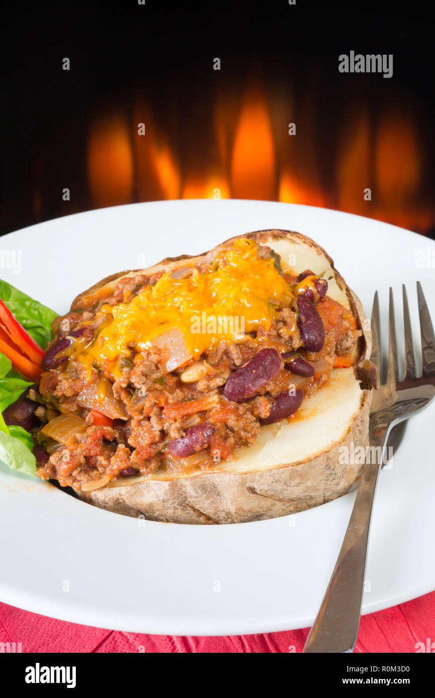 Oven baked jacket potato with a minced Beef Chili filling topped with ...