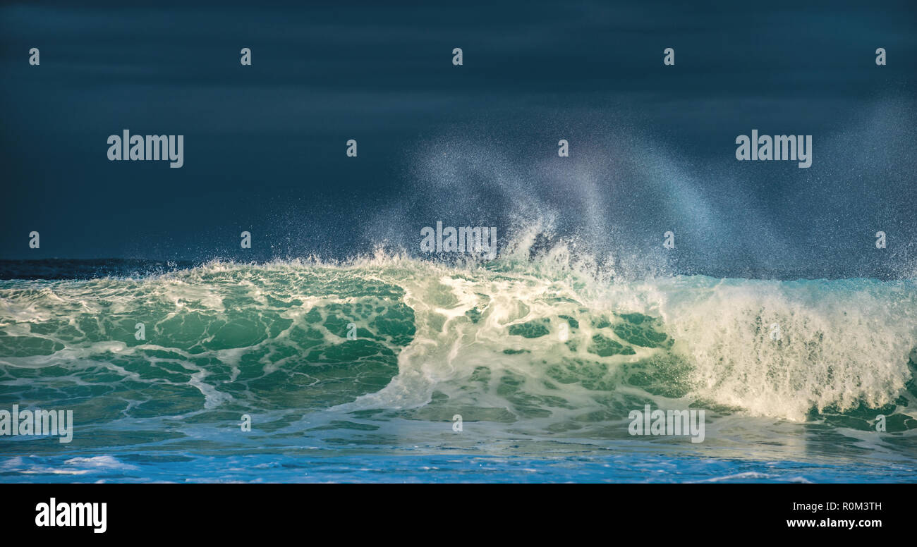 Powerful ocean wave on the surface of the ocean. Wave breaks on a ...