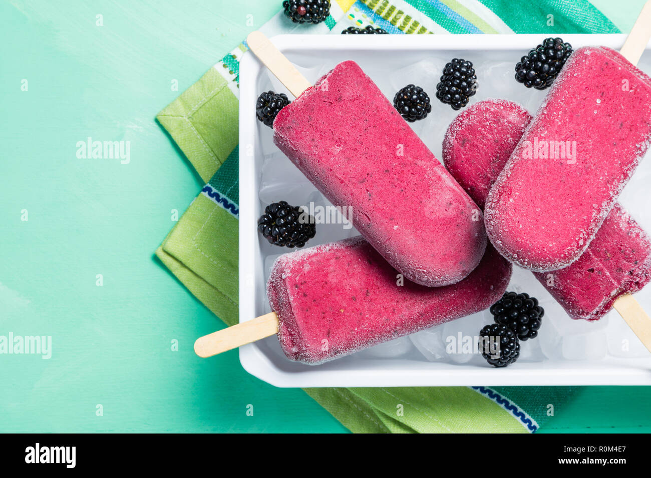 Berry ice cream on rustic wood background Stock Photo - Alamy