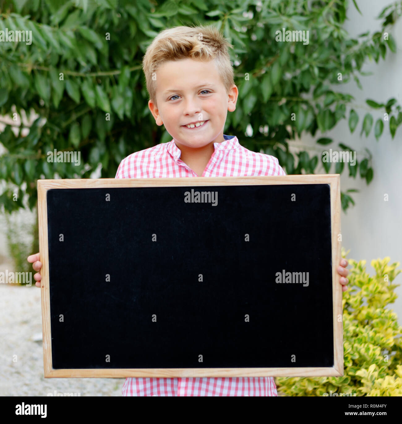 Child holding slate hi-res stock photography and images - Alamy