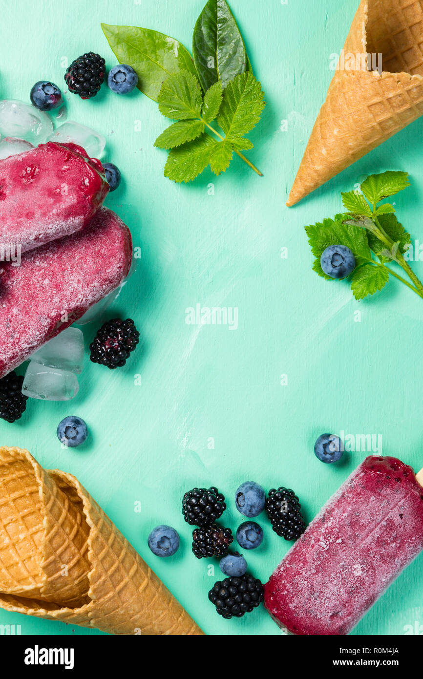 Berry ice cream on rustic wood background Stock Photo - Alamy