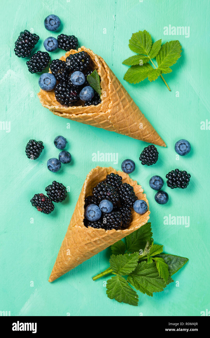 Berry ice cream on rustic wood background Stock Photo - Alamy