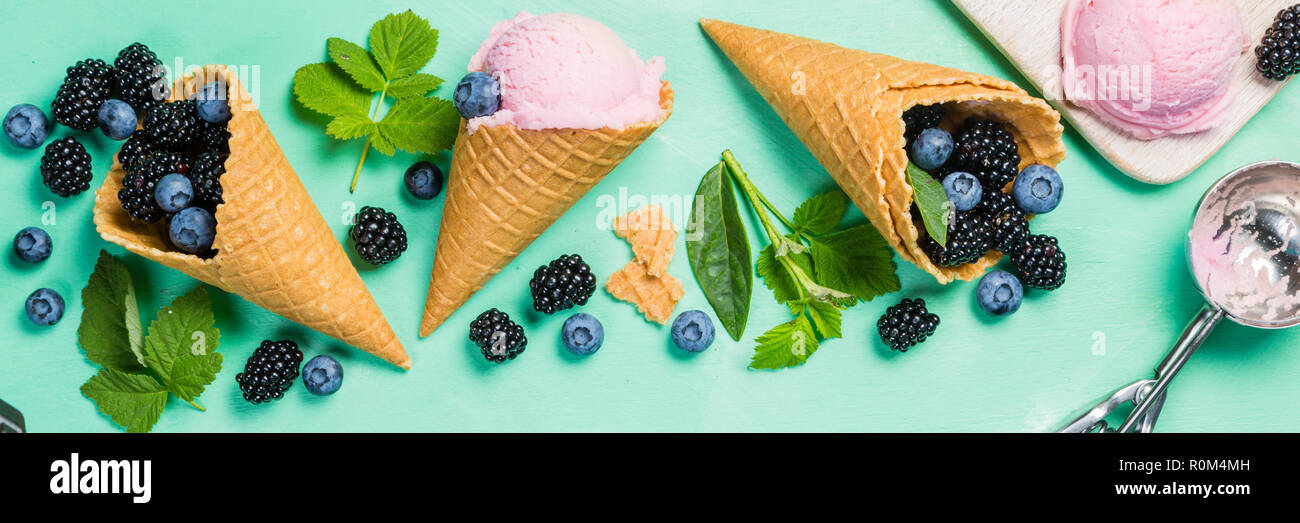 Berry ice cream on rustic wood background Stock Photo - Alamy
