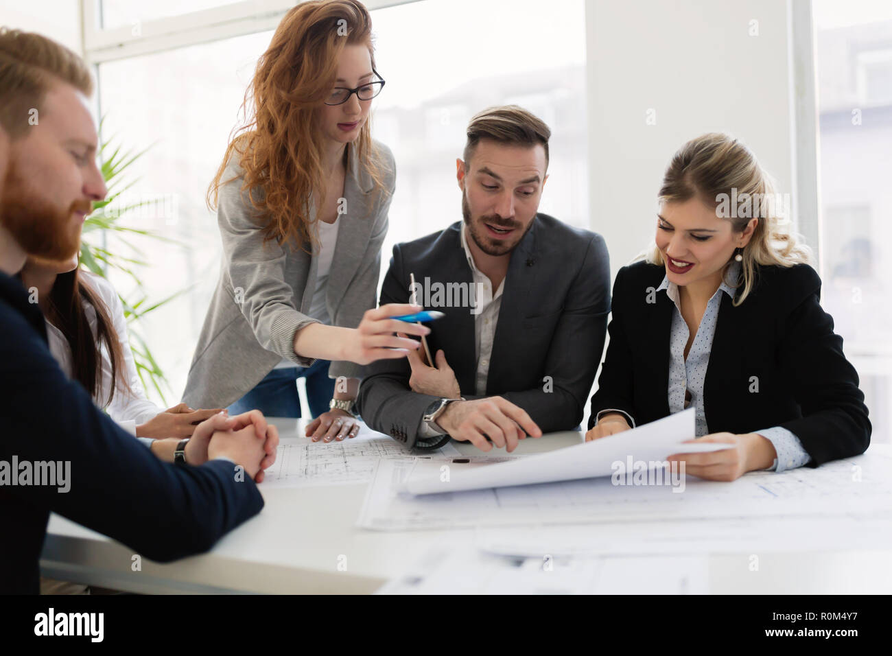 Group of architects working together on project Stock Photo - Alamy