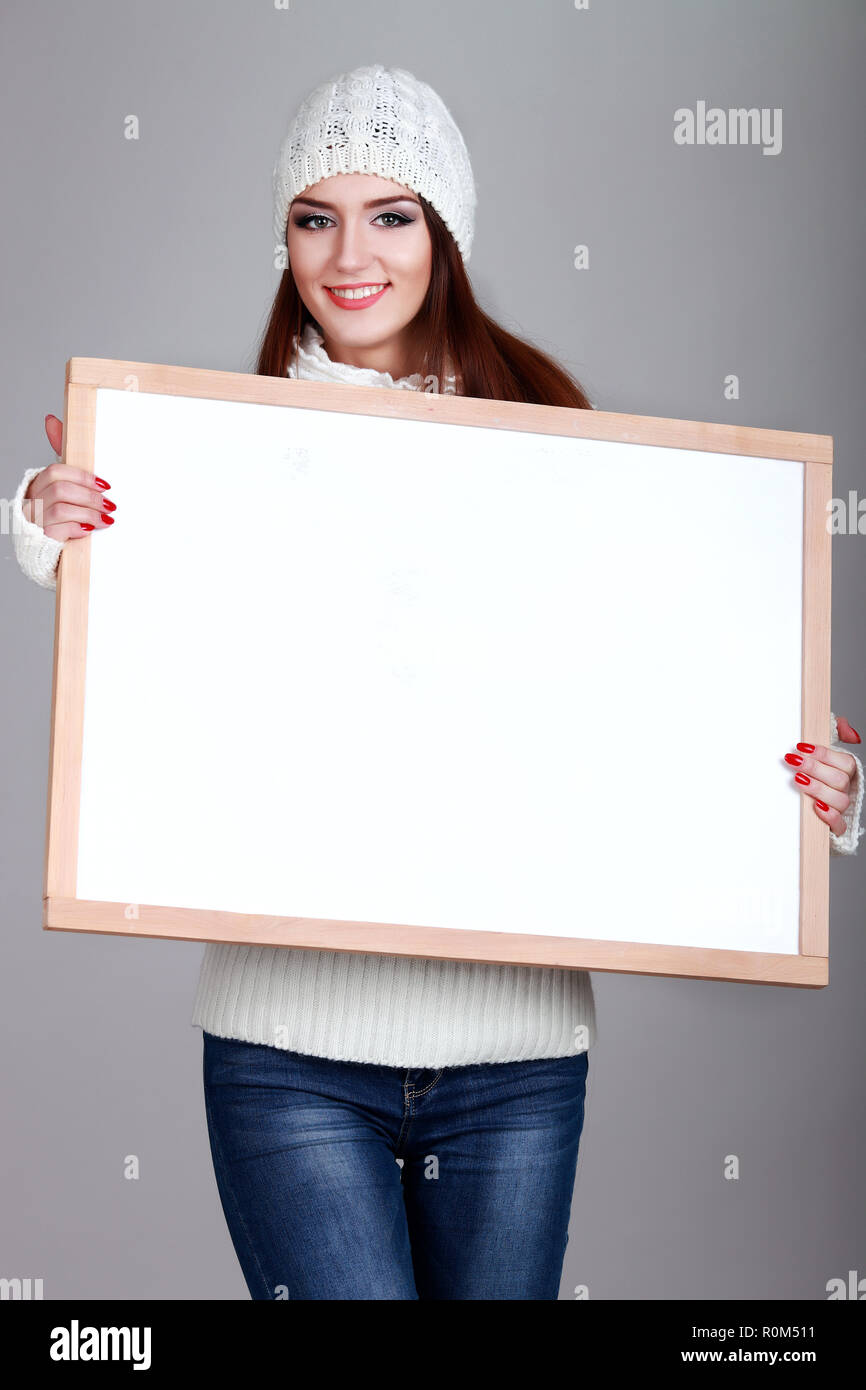 Close up christmas woman portrait behind big white card. Emotion ...