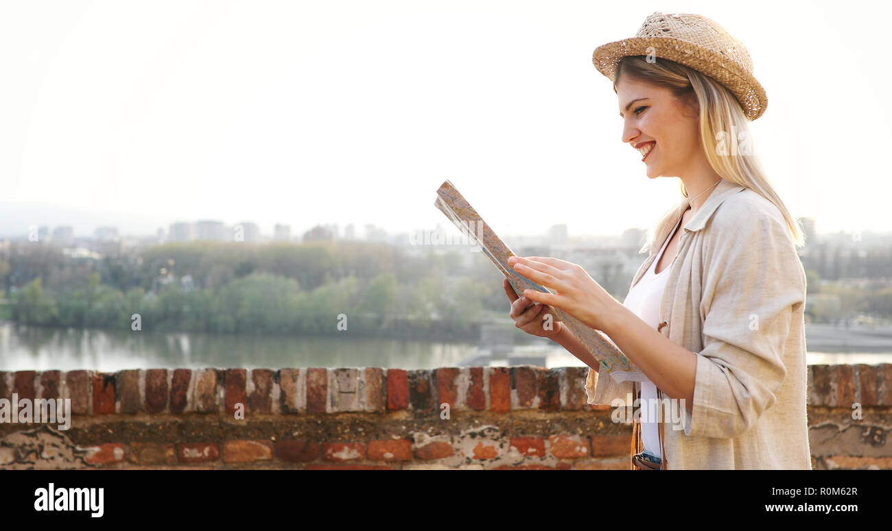 Happy female tourist sightseeing and exploring Stock Photo - Alamy