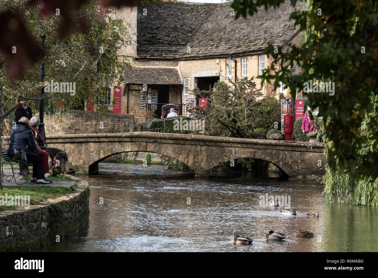 A picturesque village of centuries old honeycomb built Cotswold stone ...
