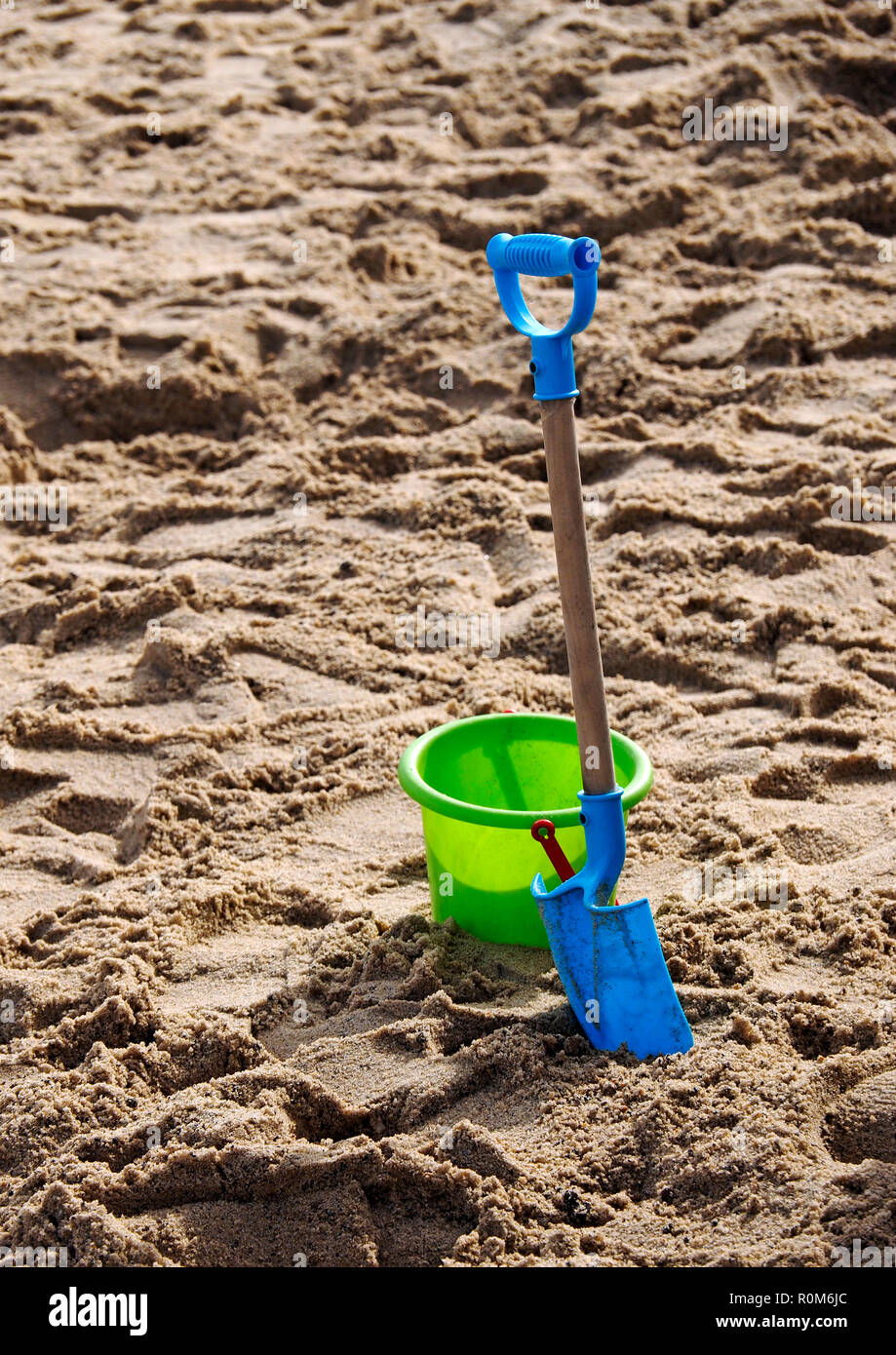 Child's bucket and spade on a sandy beach in Norfolk, UK Stock Photo ...