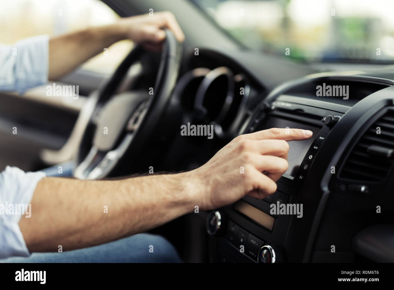 Man Using Gps Navigation System In Car to travel Stock Photo - Alamy