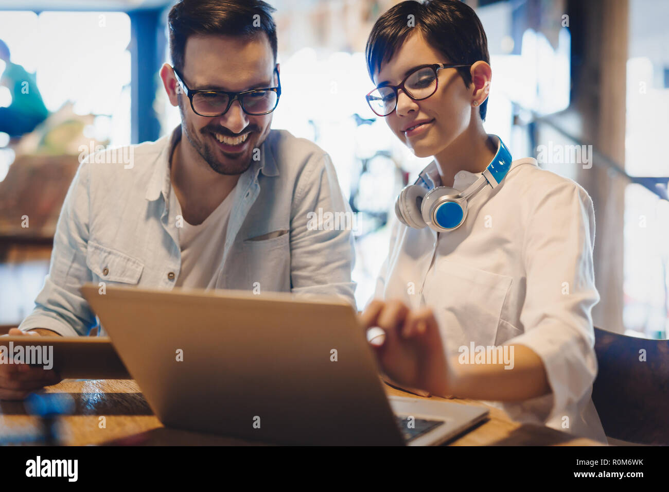 Young beautiful students studying in modern library Stock Photo - Alamy