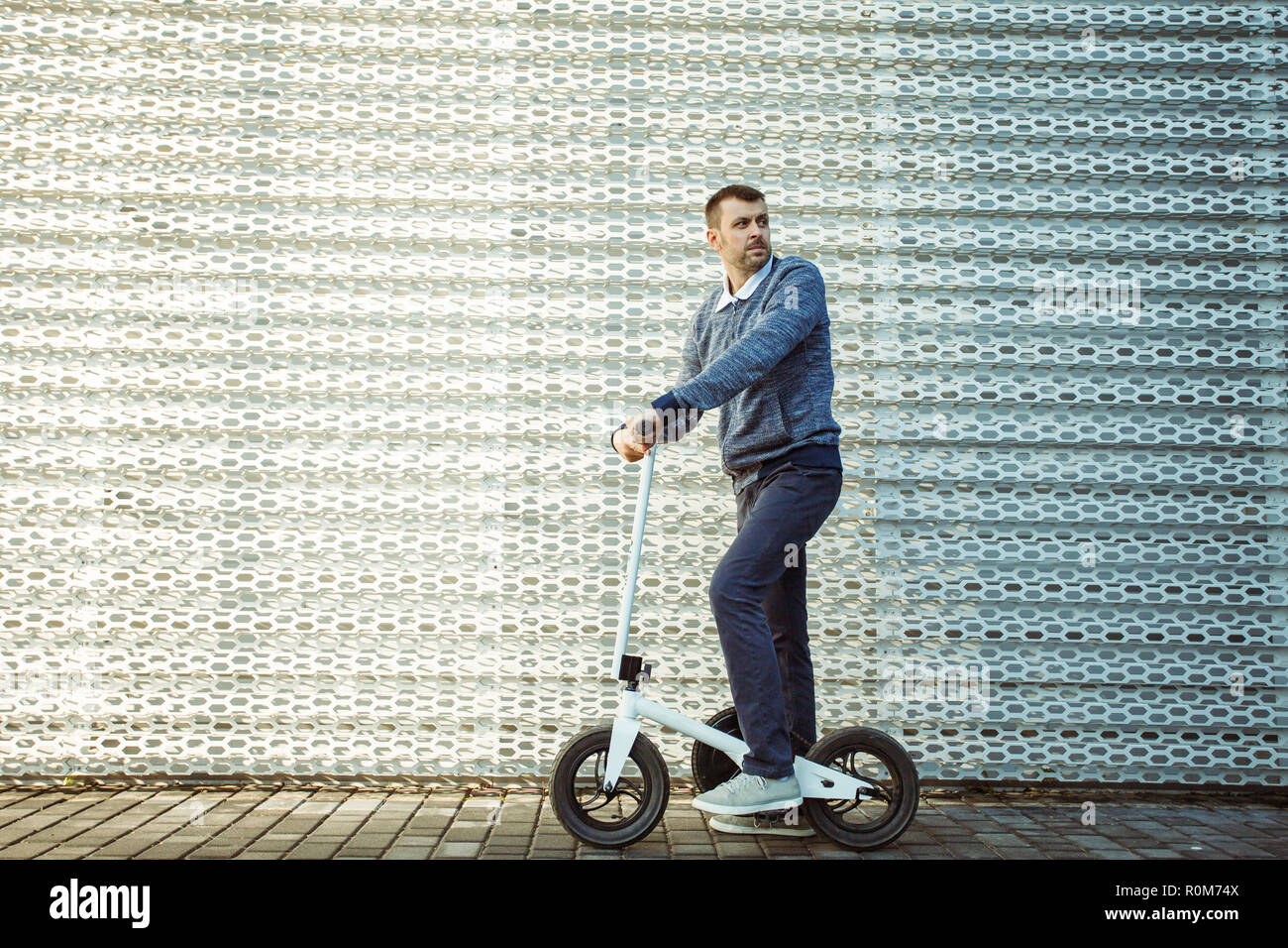 Happy man on scooter hi-res stock photography and images - Alamy