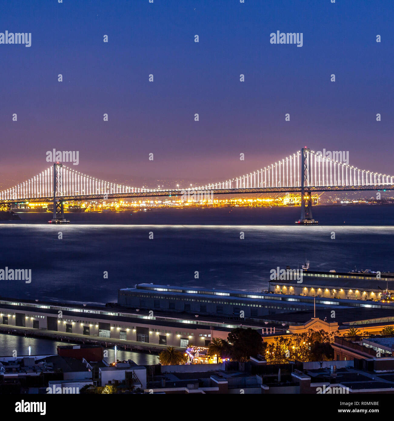 Bay Bridge in San Francisco and city view at night Stock Photo - Alamy