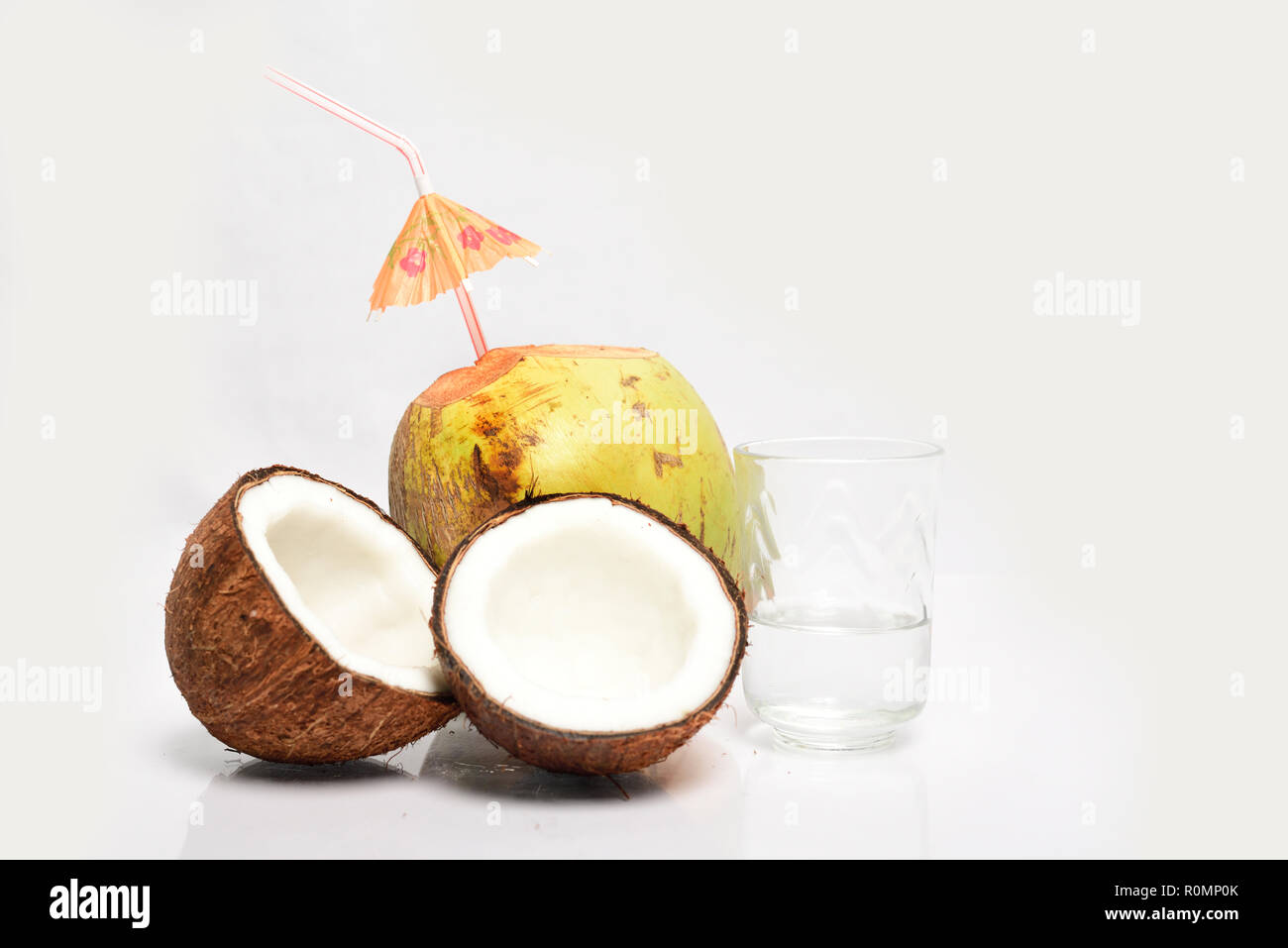 Close-up of Broken coconut isolated on white background Stock Photo - Alamy