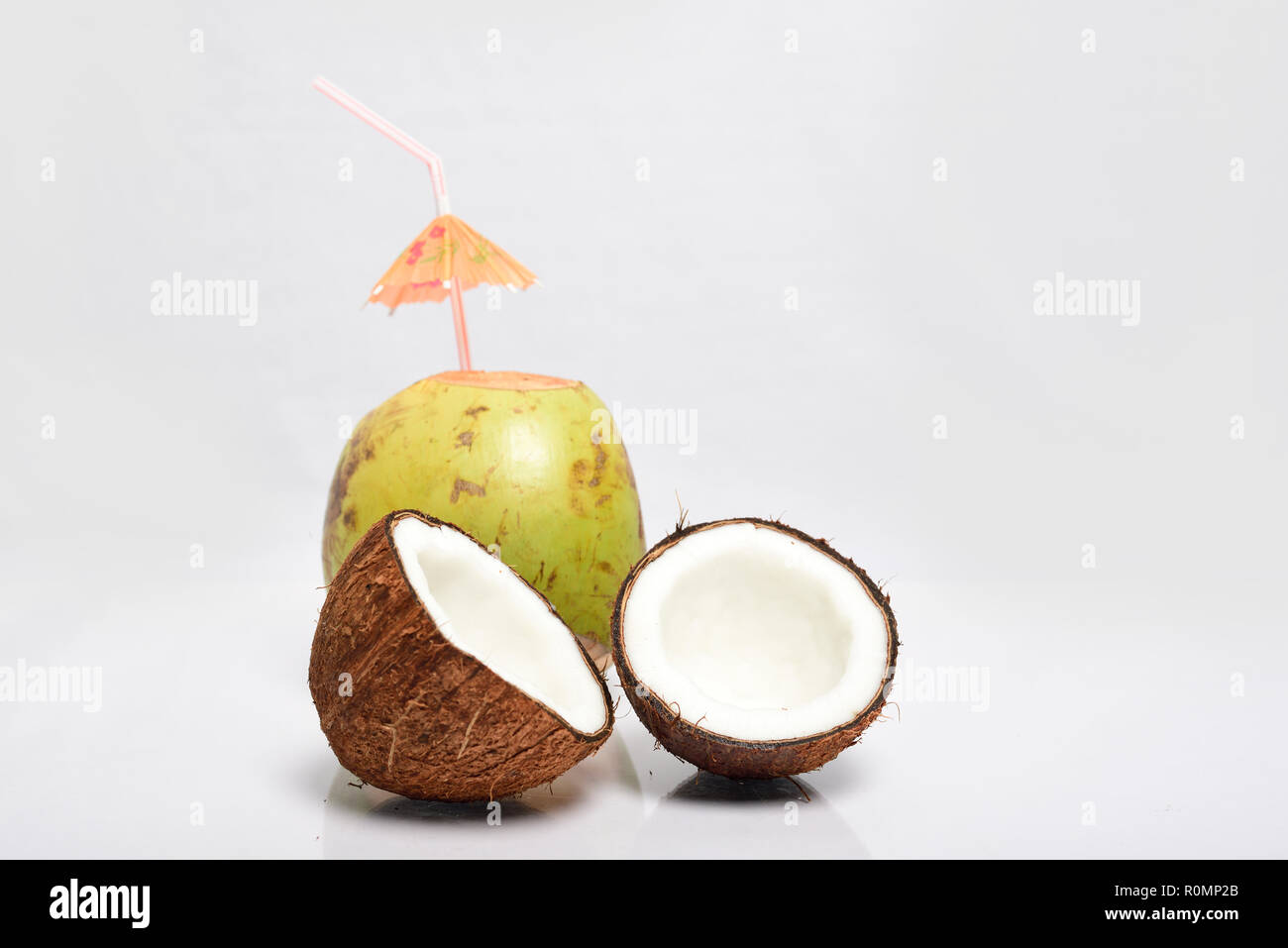 Close-up of Broken coconut isolated on white background Stock Photo - Alamy