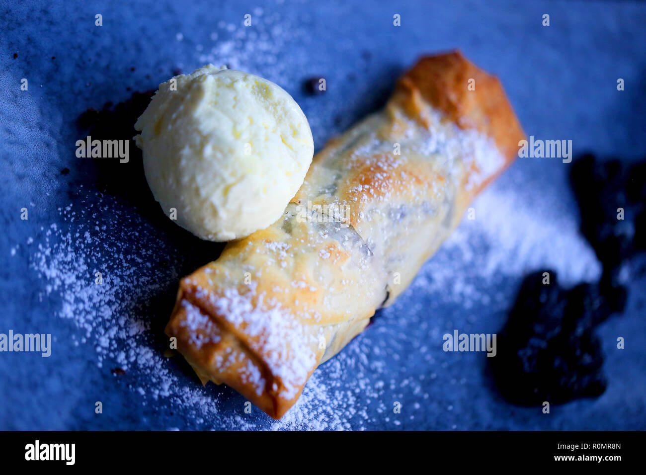 Macro photo of bright blueberry pie and ice cream on a dark plate Stock ...