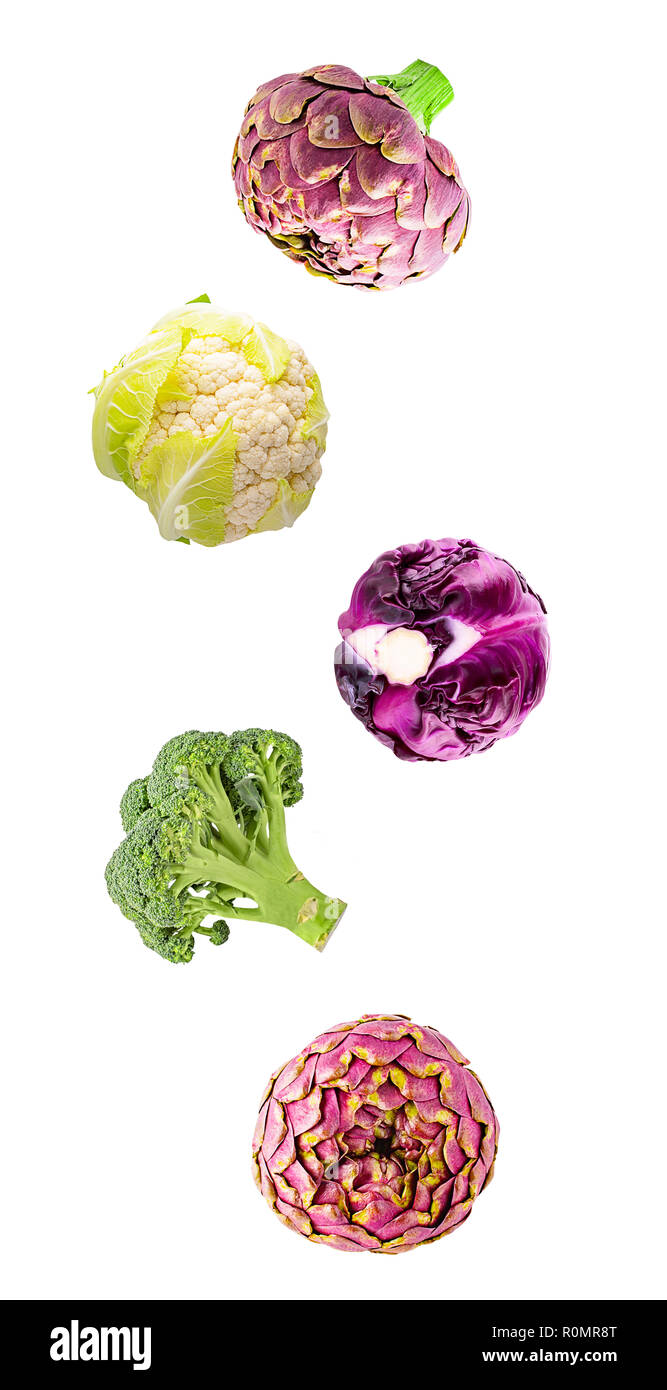 Fresh flying vegetables ingredients isolated on a white background ...