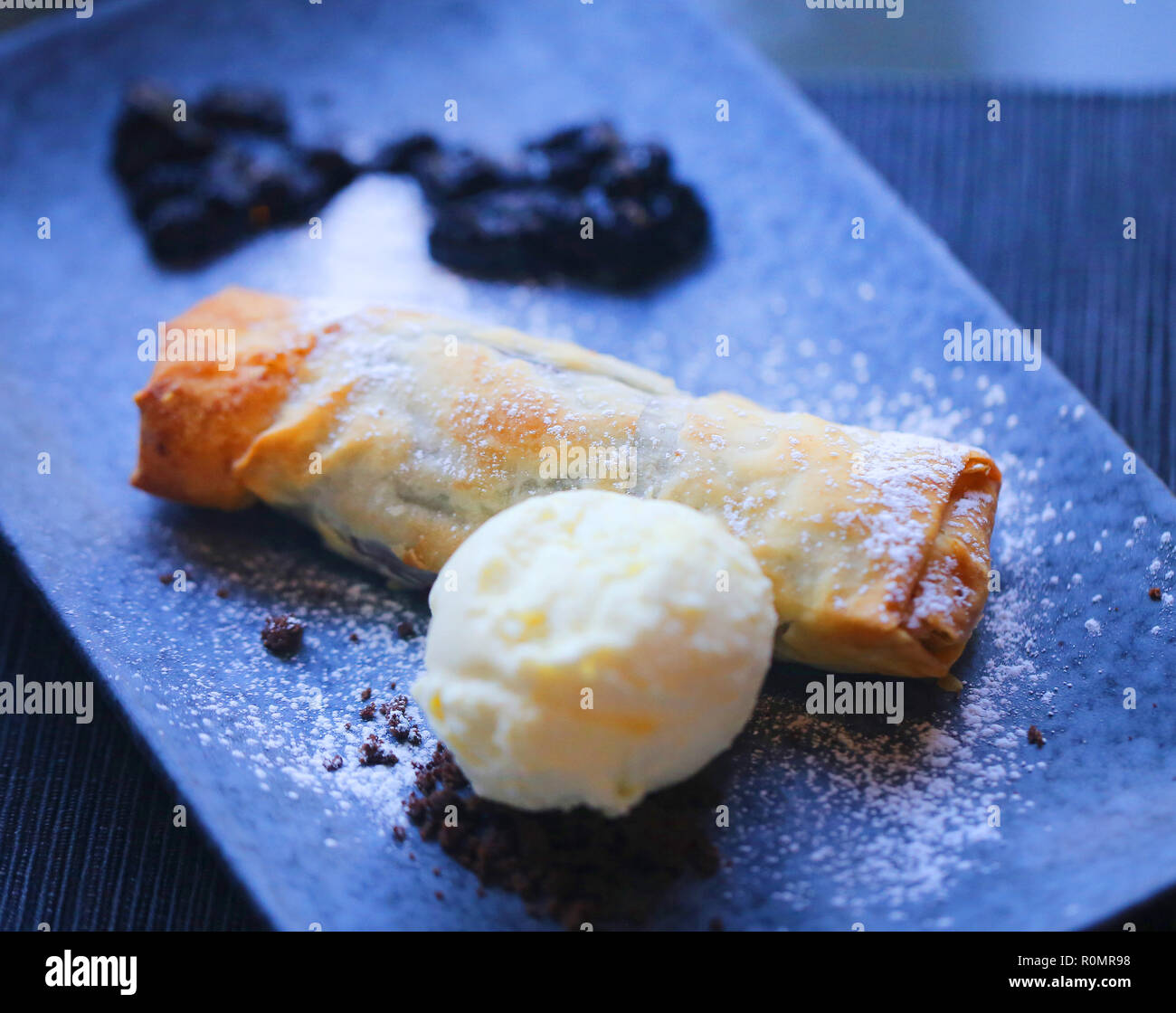 Macro photo of bright blueberry pie and ice cream on a dark plate Stock ...