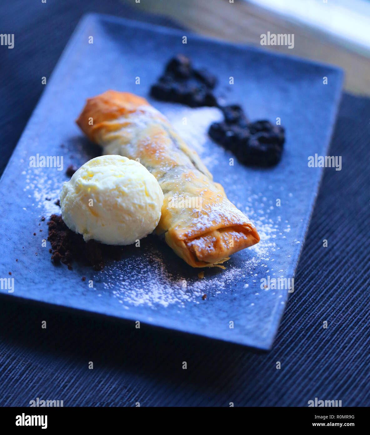 Macro photo of bright blueberry pie and ice cream on a dark plate Stock ...