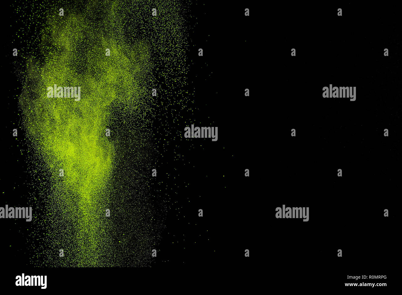 Abstract green paint Holi. Abstract green powder explosion on black ...
