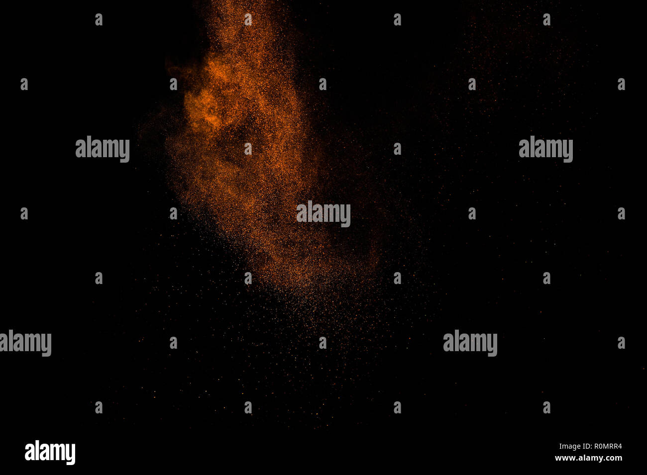 Abstract orange paint Holi. Abstract orange powder explosion on black ...