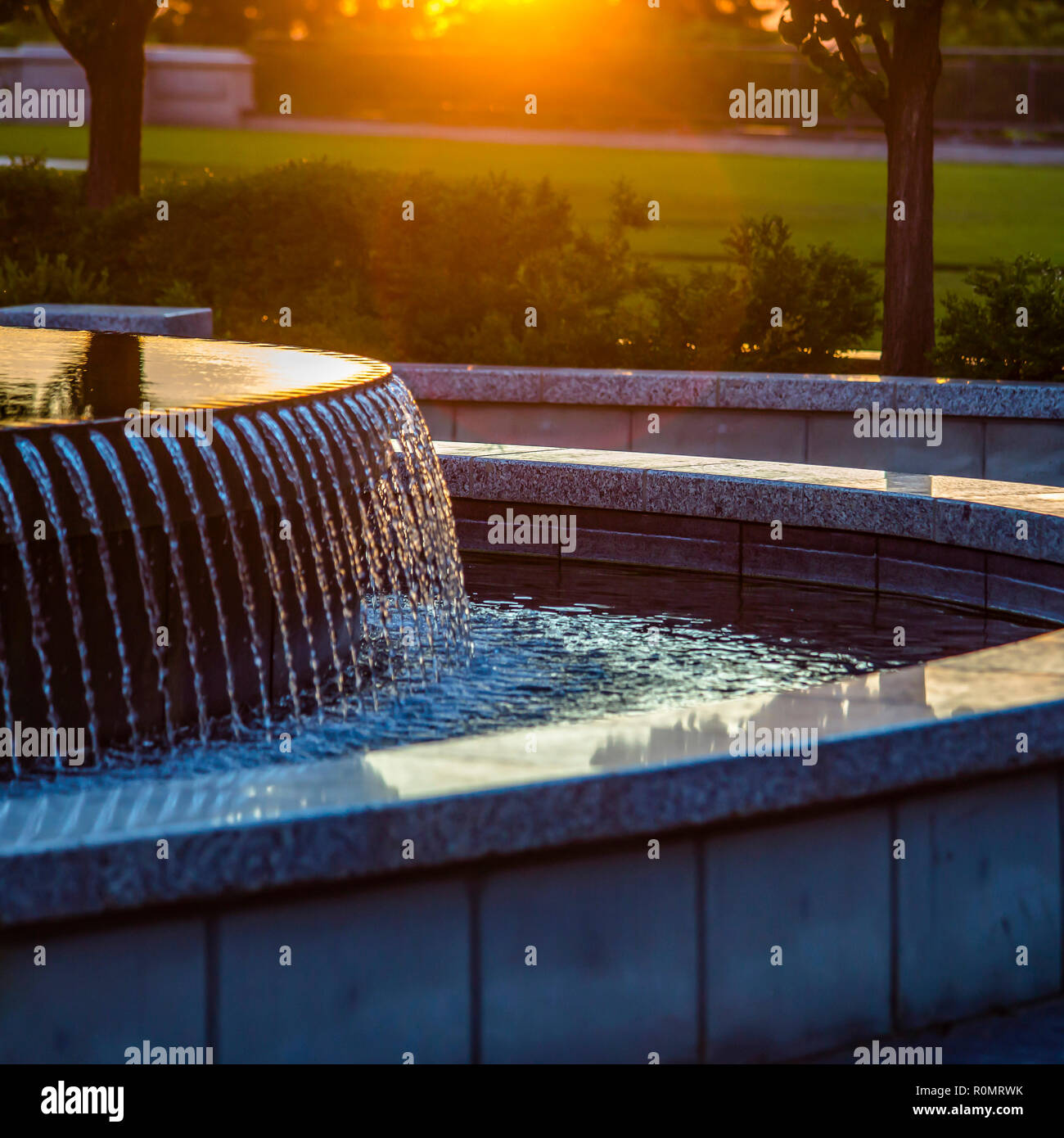 Sunset view of a fountain with sparkling water Stock Photo - Alamy