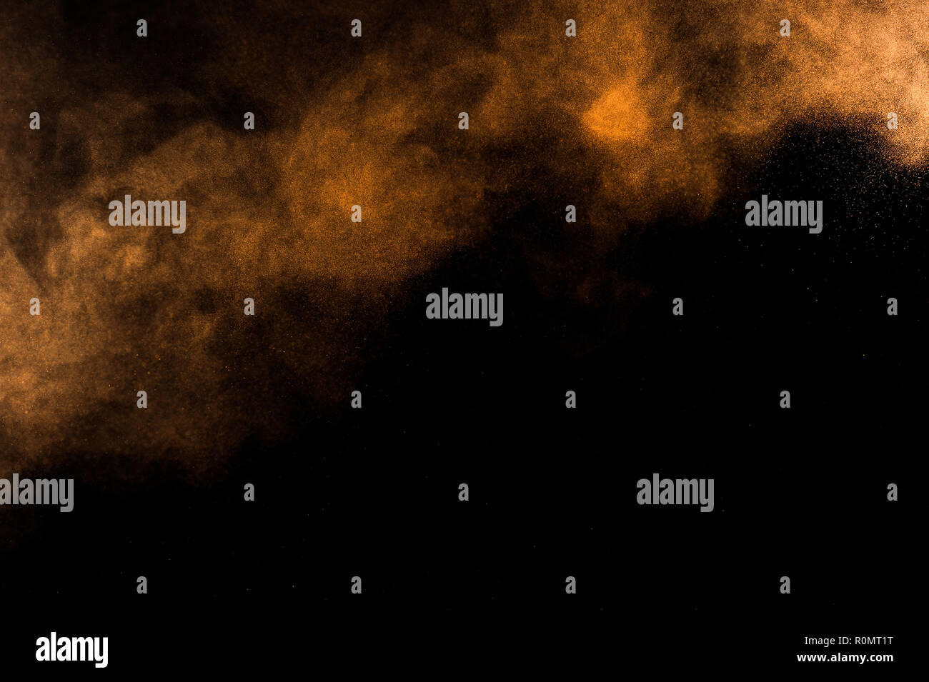Abstract orange paint Holi. Abstract orange powder explosion on black ...