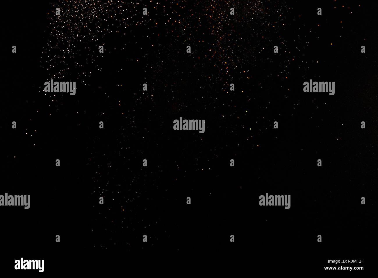 Abstract orange paint Holi. Abstract orange powder explosion on black ...