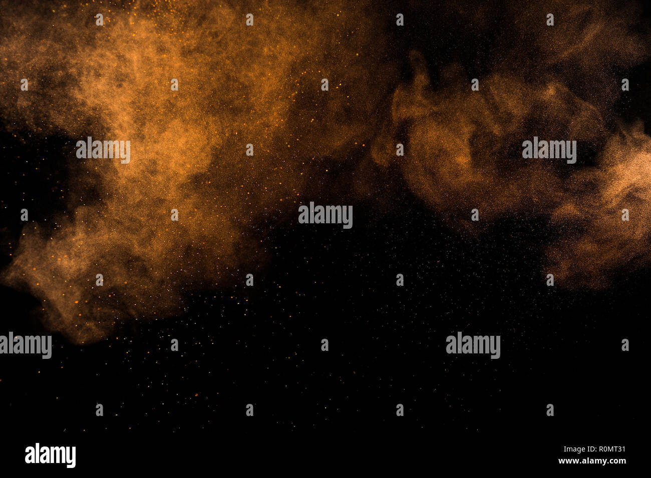 Abstract orange paint Holi. Abstract orange powder explosion on black ...