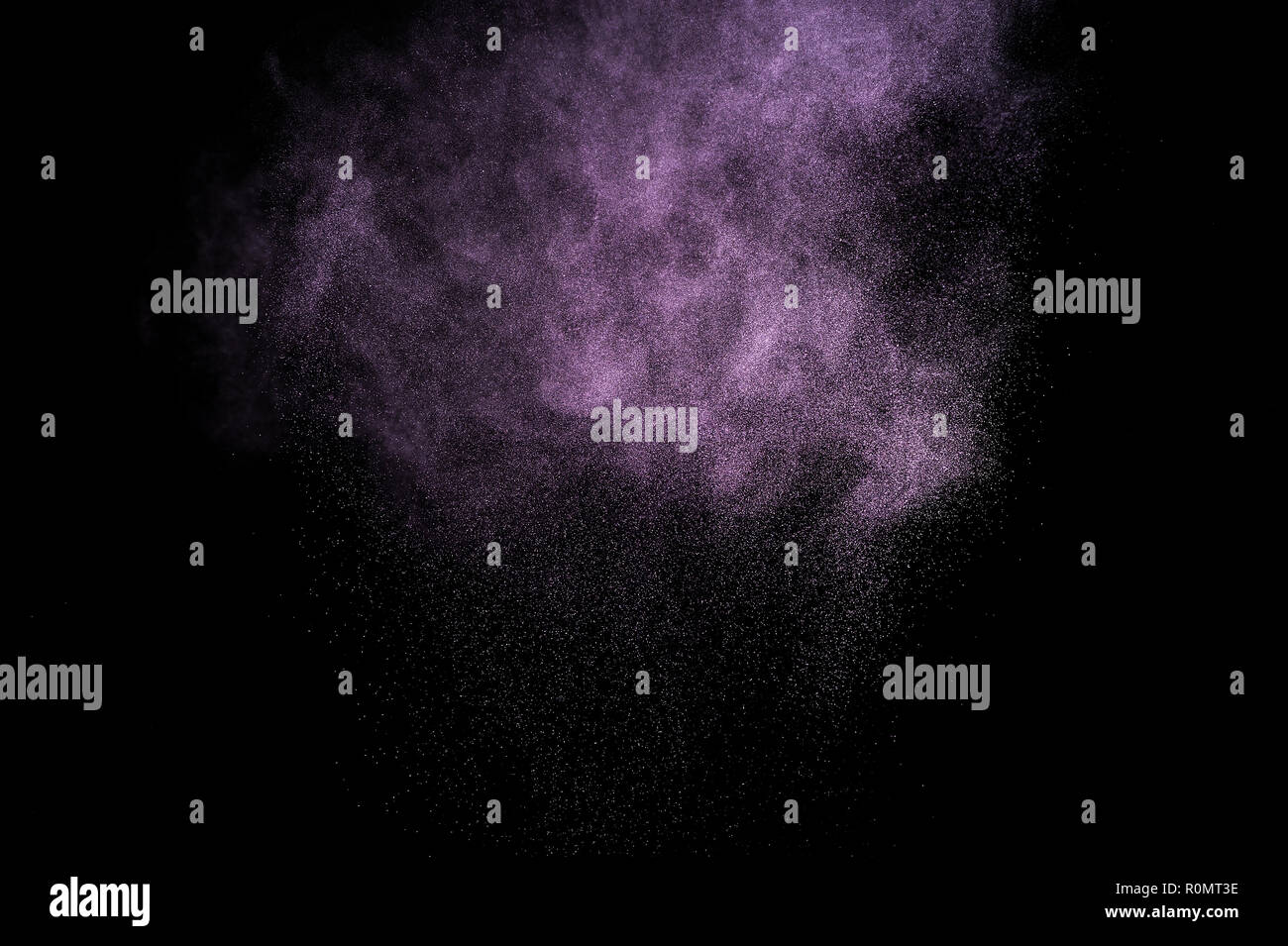 Abstract purple paint Holi. Abstract purple powder explosion on black ...