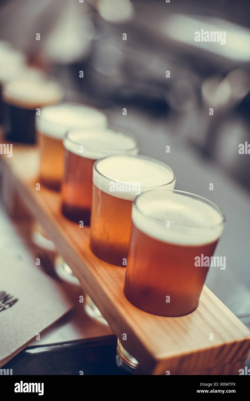 Selection of beers on a tasting mat Stock Photo - Alamy