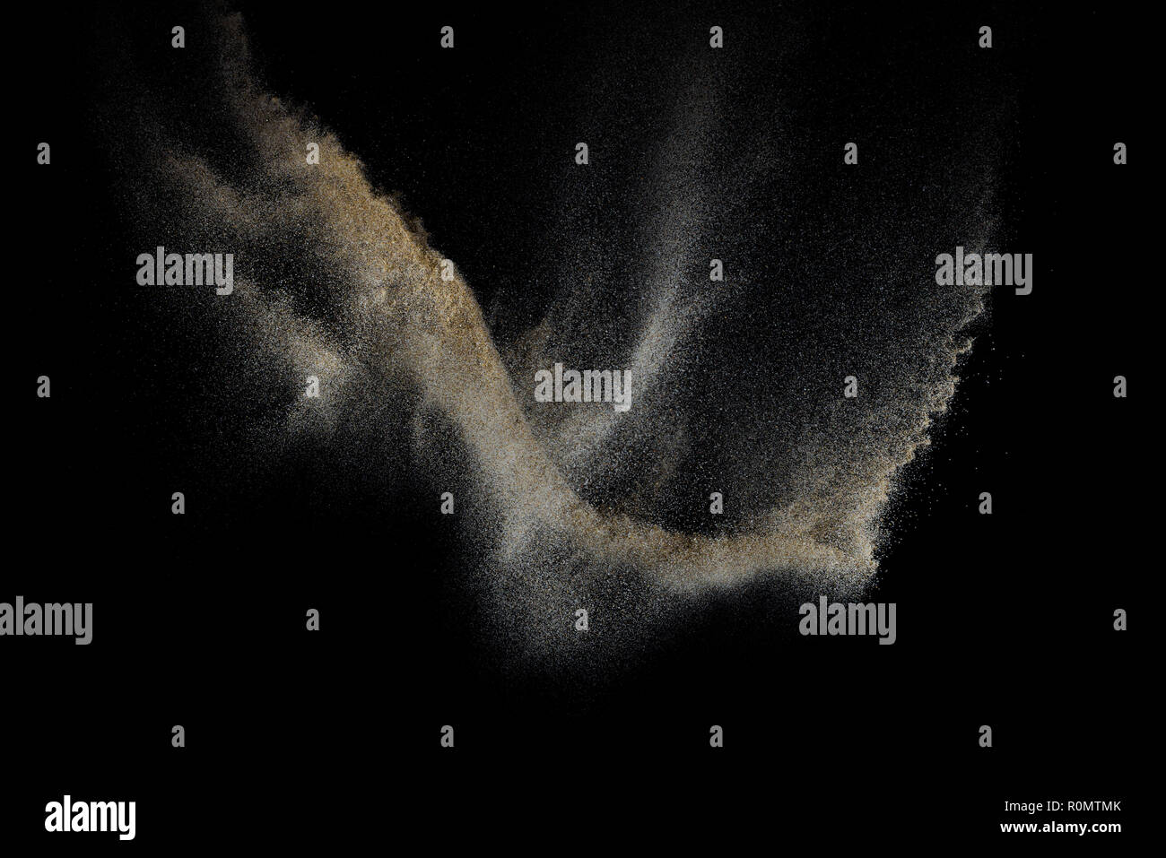 Sandy explosion isolated on black background. Abstract particles cloud ...