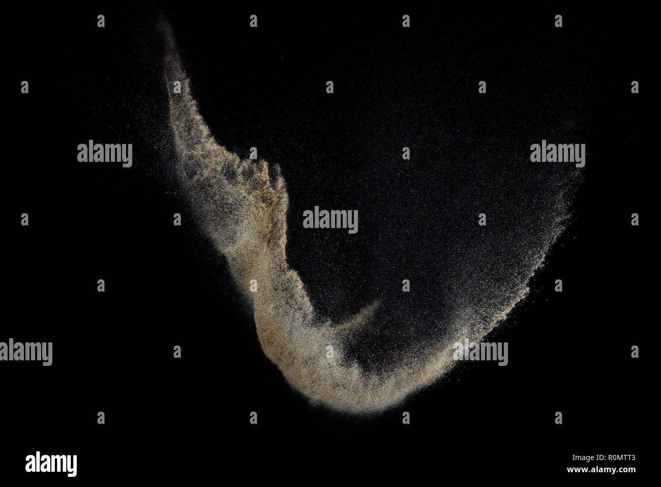 Sandy explosion isolated on black background. Abstract particles cloud ...