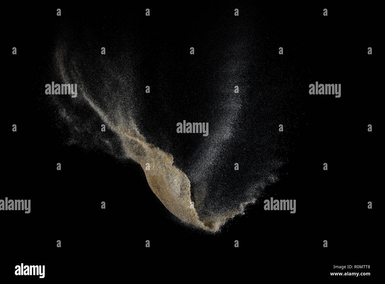 Sandy explosion isolated on black background. Abstract particles cloud ...