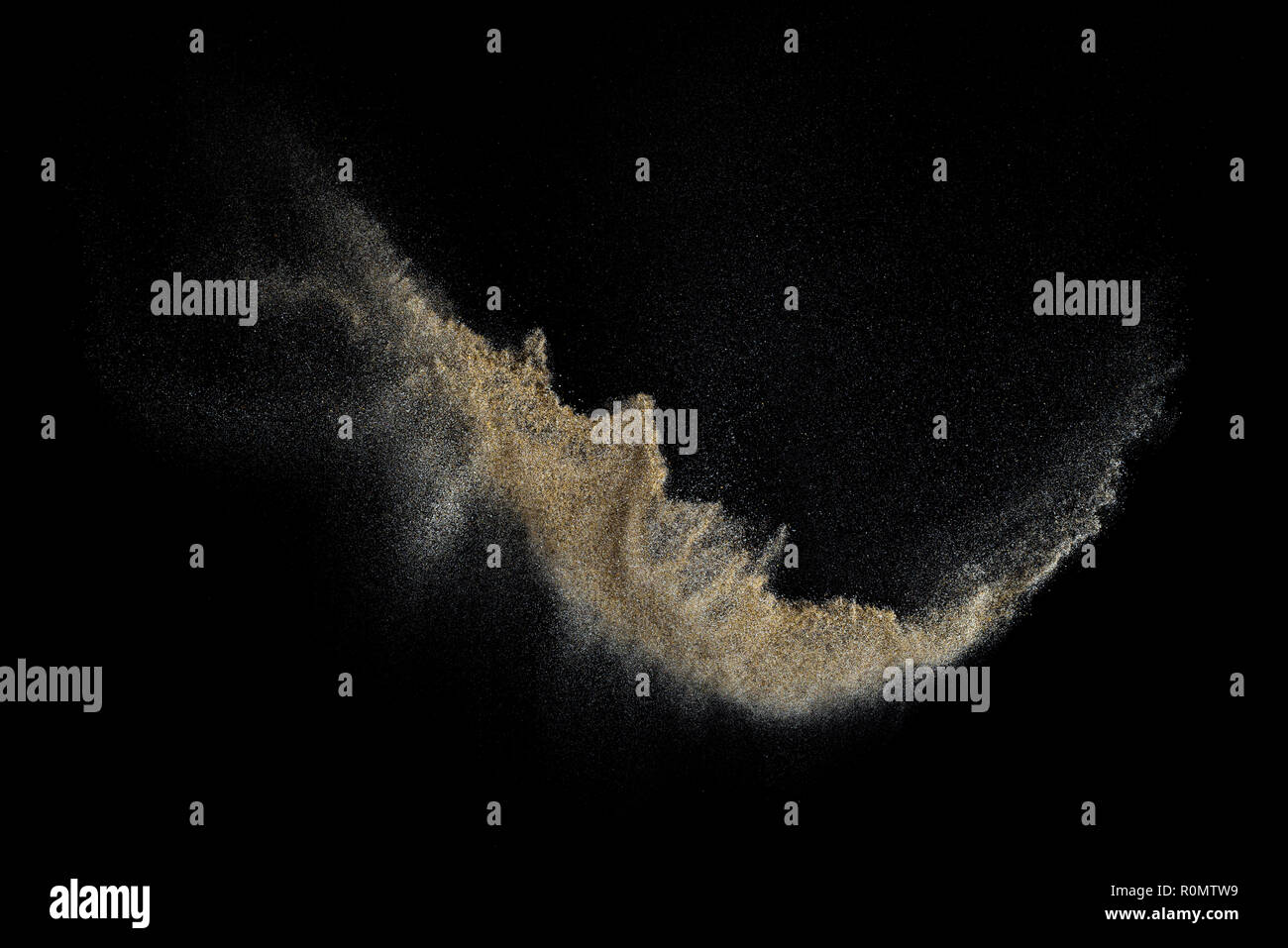 Sandy explosion isolated on black background. Abstract particles cloud ...